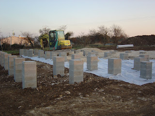 Construction maison bois massif: Plots Beton