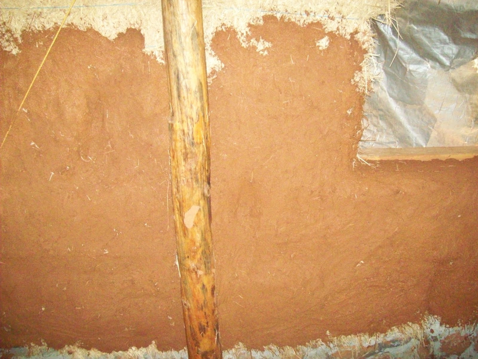 Solar Compound: Mud Plastering the Inside of the House...