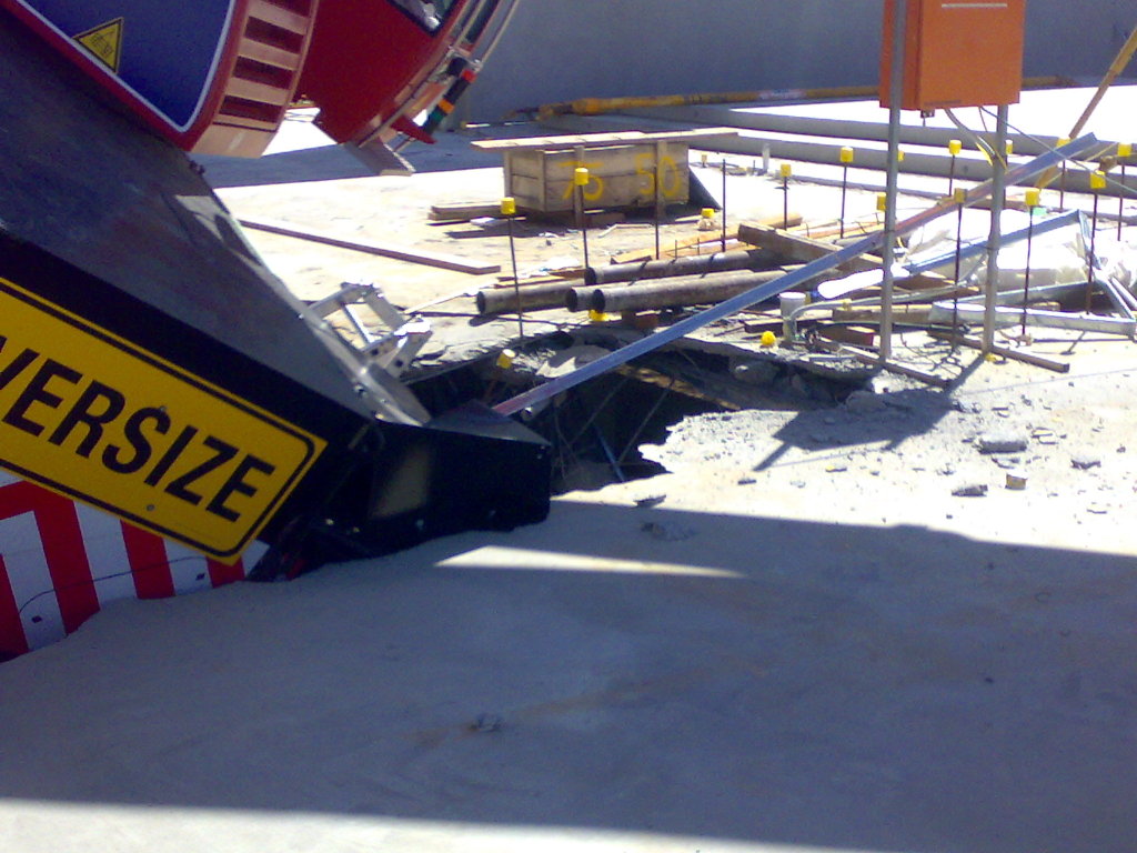 Industry Mayhem: Crane Through Concrete