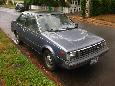 OLD PARKED CARS.: 1984 Datsun/Nissan Sentra Sunroof Coupe.