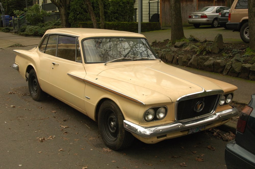 OLD PARKED CARS.: 1962 Plymouth Valiant Signet 200 Coupe.