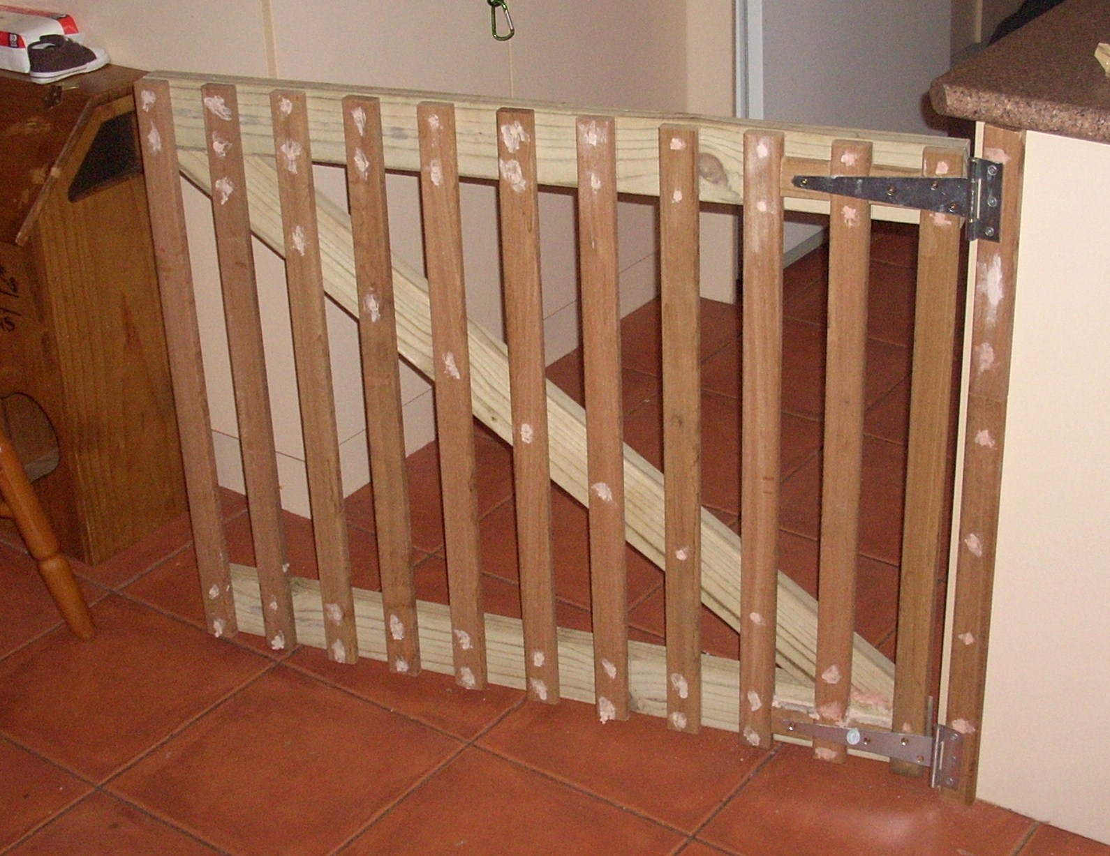 Yelling at the tv: Kid proofing the kitchen with a wooden gate