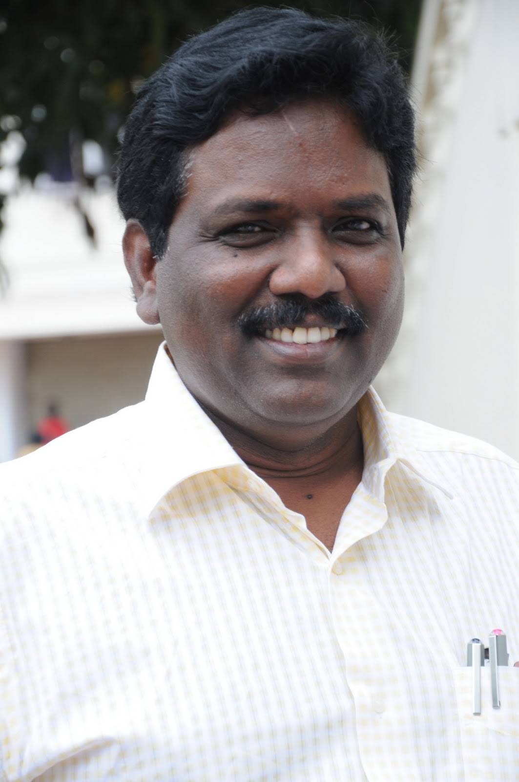 Ravikumar Logo