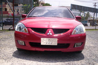 "PANAMA RACING SOLUTION": Precioso Mitsubishi Lancer 2006, Color Rojo