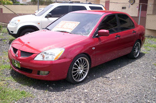 "PANAMA RACING SOLUTION": Precioso Mitsubishi Lancer 2006, Color Rojo