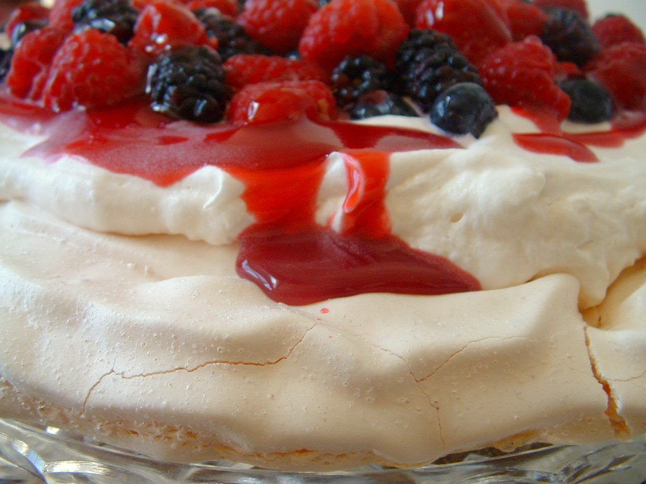 Summer Berry Pavlova with a Raspberry Coulis Sauce - A Feast For The Eyes
