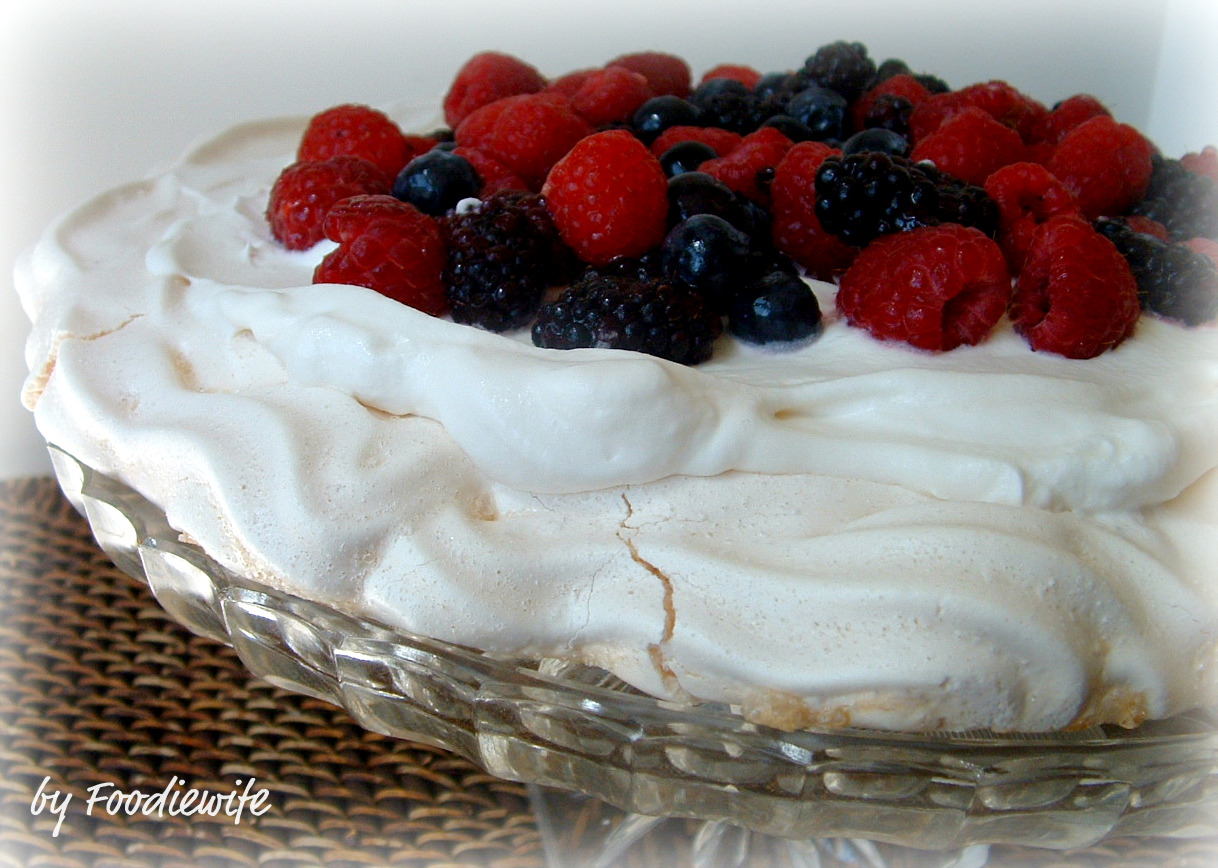 Summer Berry Pavlova with a Raspberry Coulis Sauce - A Feast For The Eyes