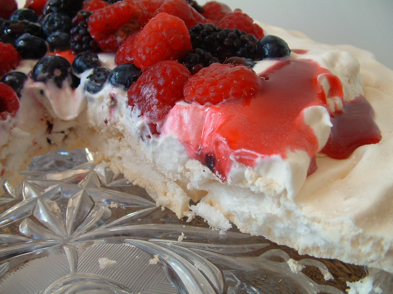 Summer Berry Pavlova with a Raspberry Coulis Sauce - A Feast For The Eyes