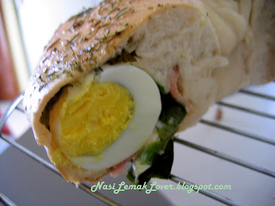 Nasi Lemak Lover: Rolled bread of bacon, hard boiled egg, cheese and herbs