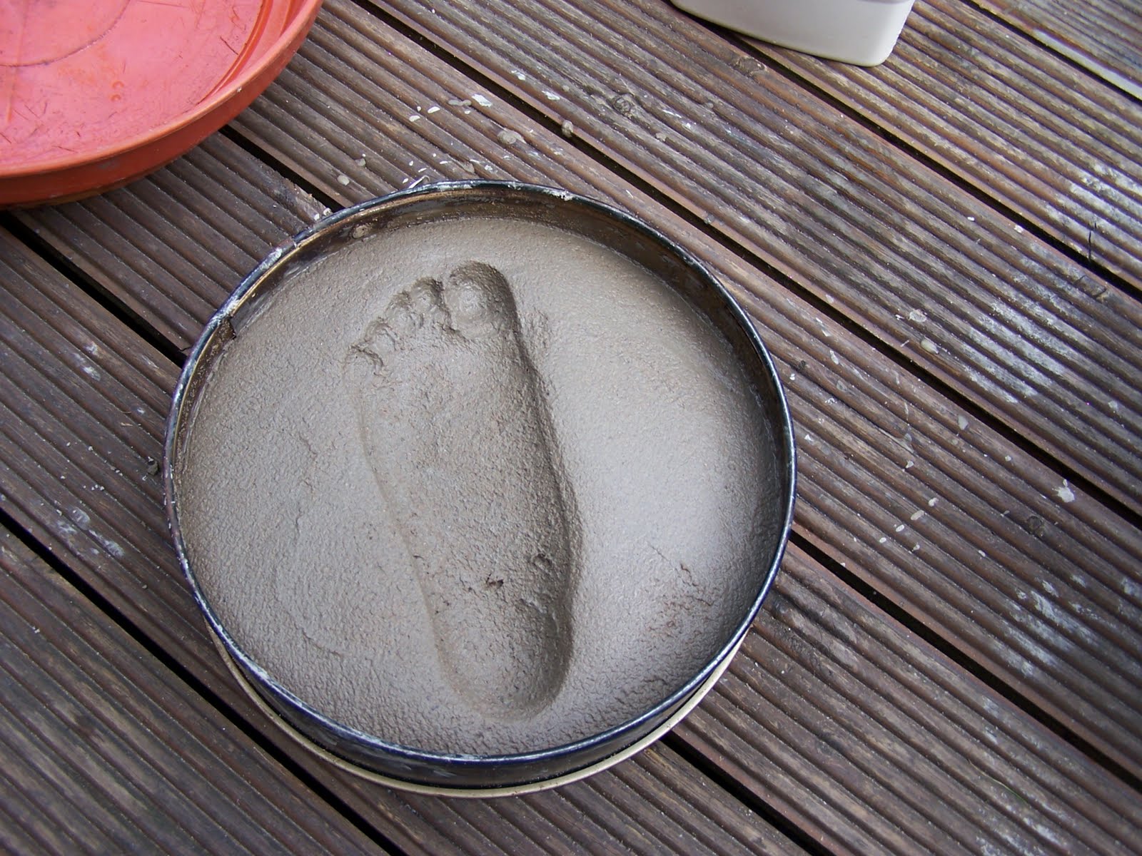 Glittering Shards | Make mosaic cement foot prints and hand prints