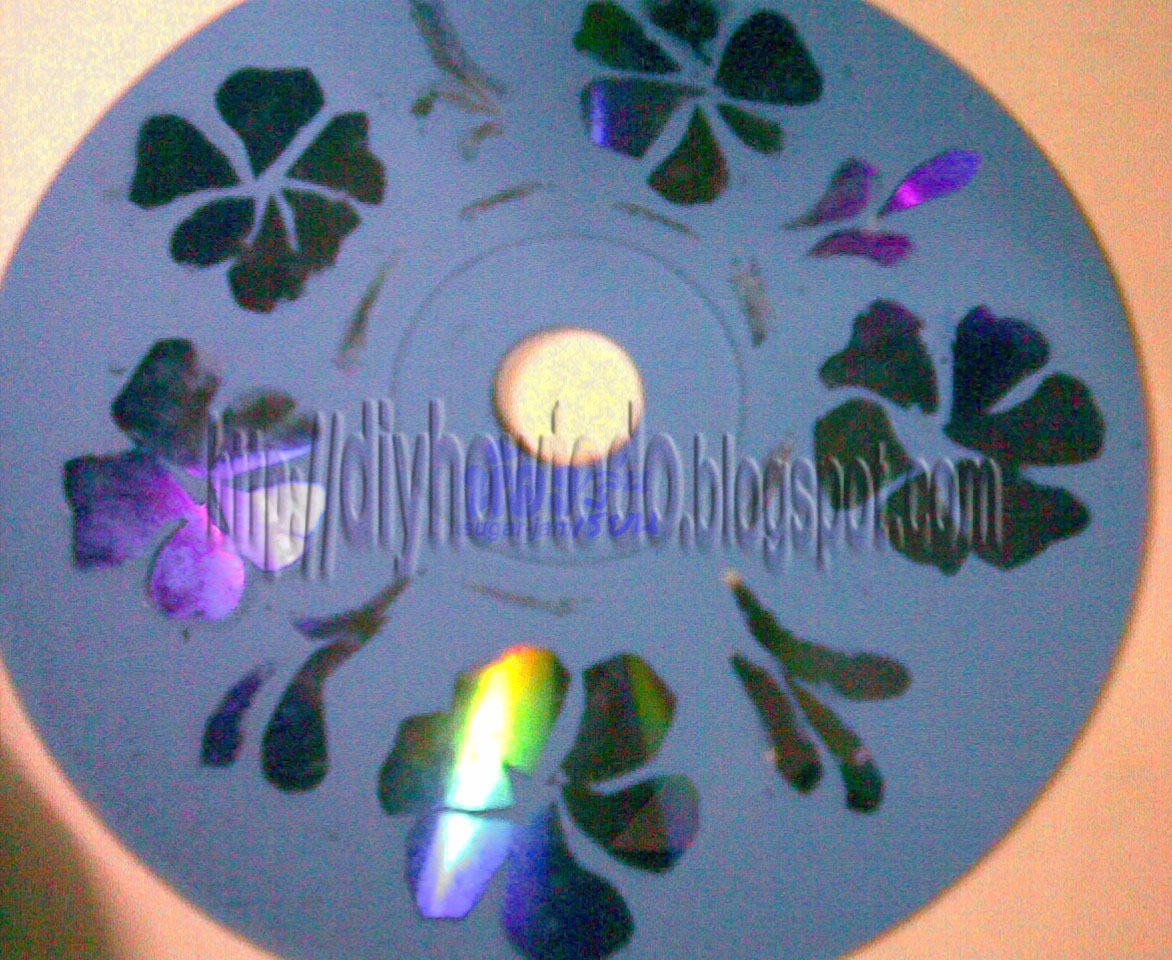 DIY old CD to art work or decoration. - D . I . Y . Done ! It 's Yours