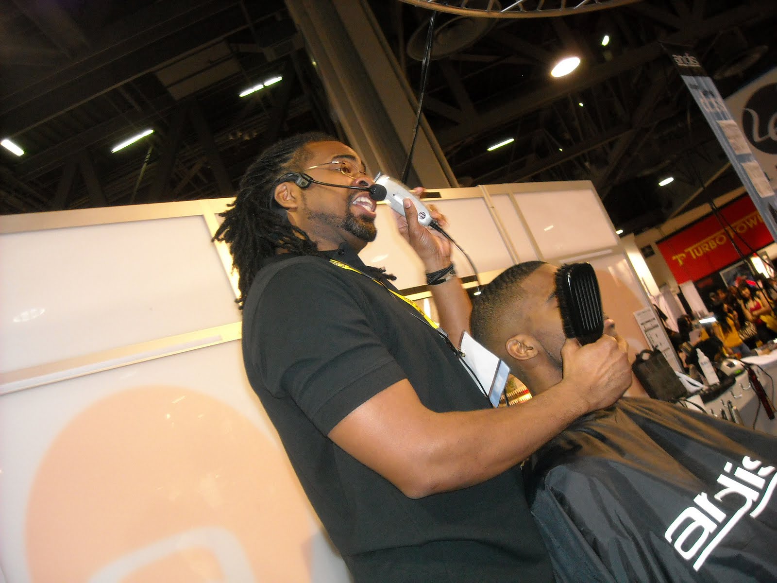 Andis Company: Eric Cheek on stage at Andis