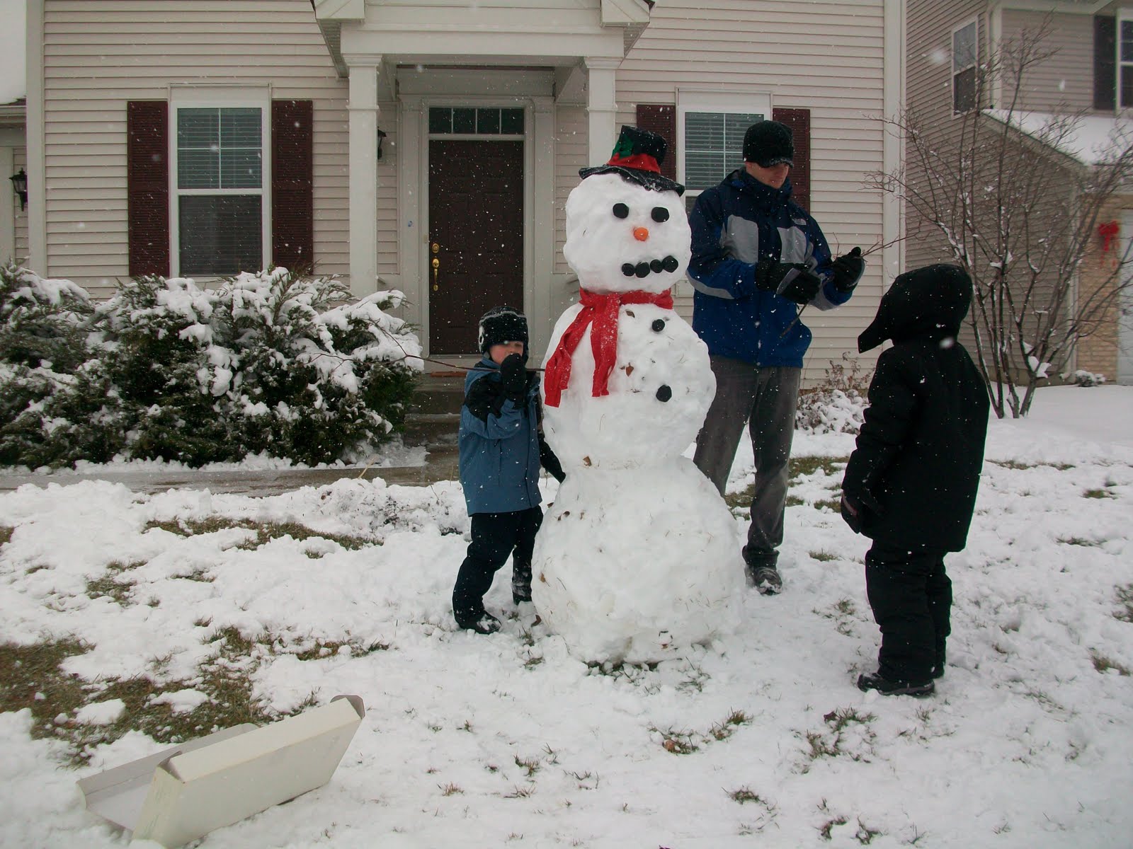 The Langel Family: Building a snowman