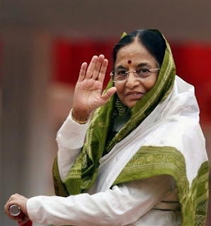 New Indian President Pratibha Patil waves after inspecting a ceremonial ...