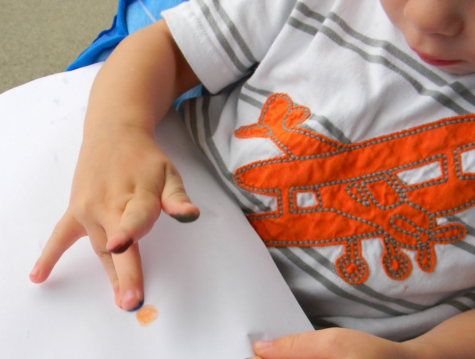 Have him press his finger down onto the paper.