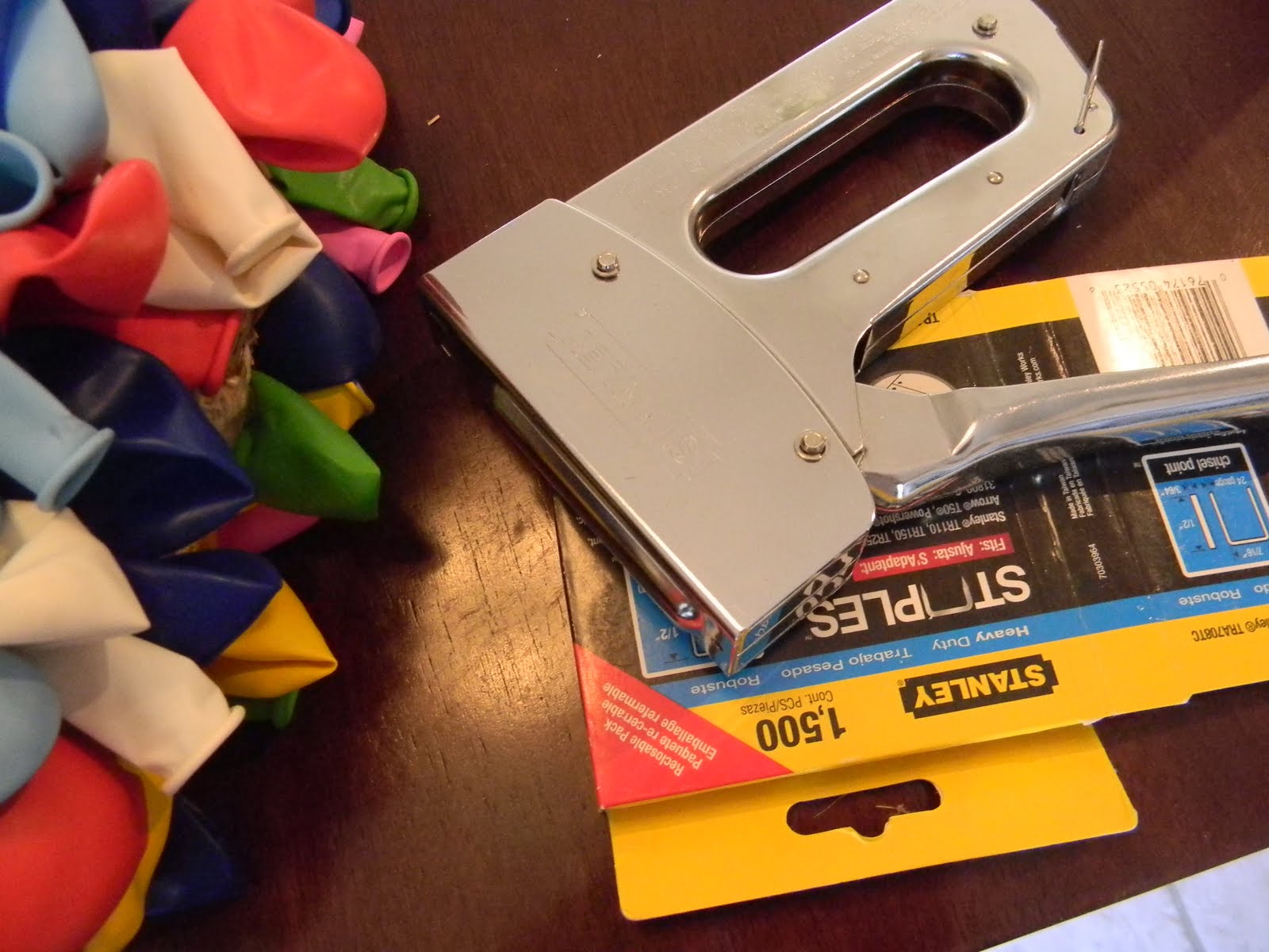 Now, staple the balloons right into the straw wreathe.